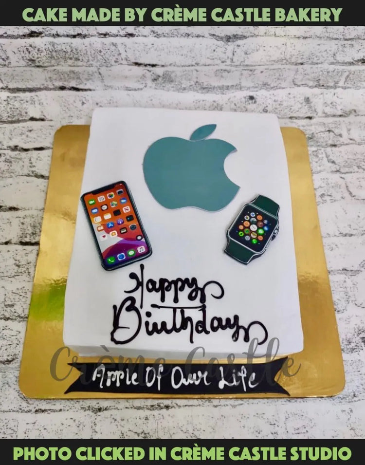 A square cake with apple products on the top. For someone who loves the ...